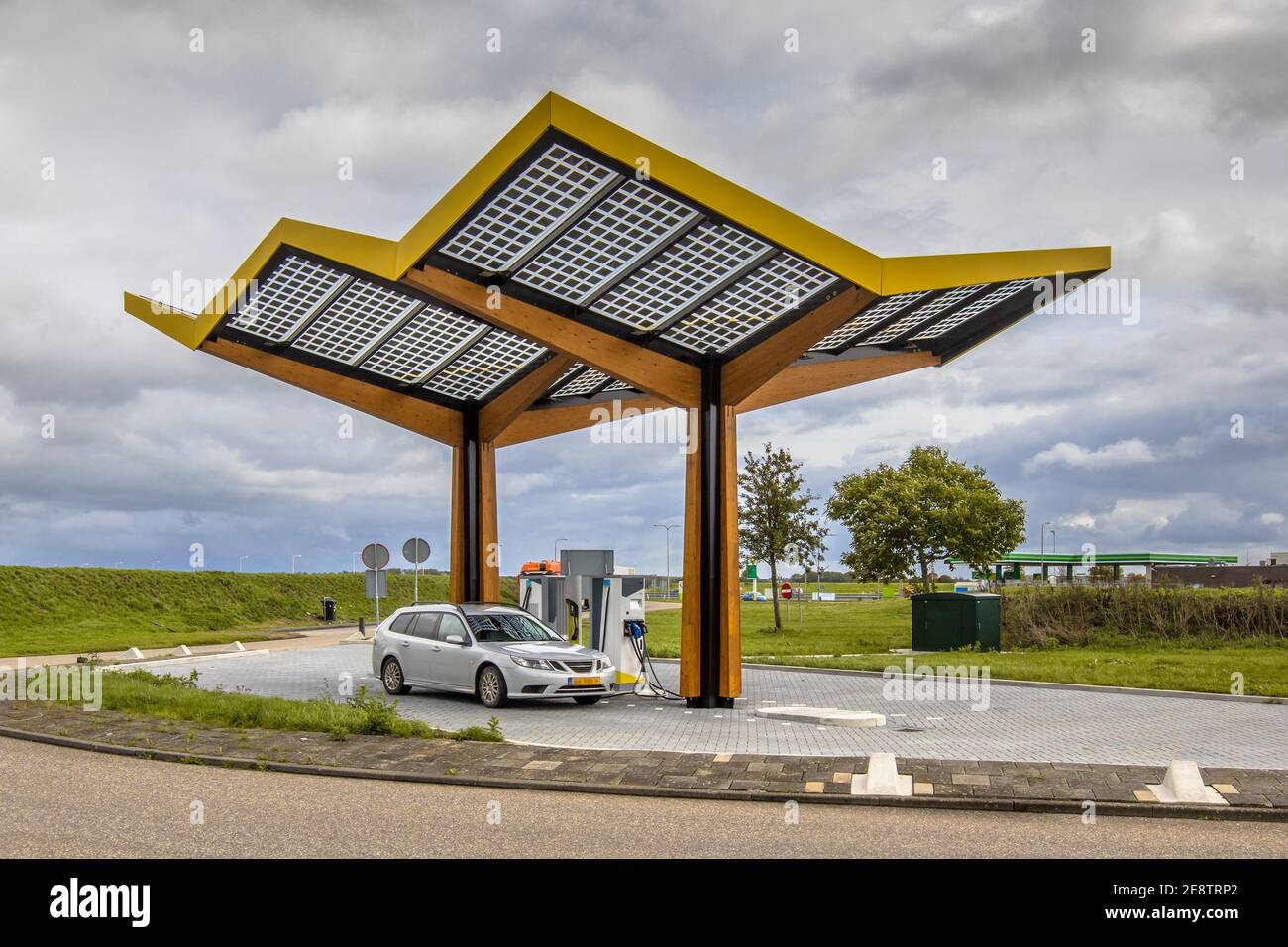 Electric car filling at electricity charge station in the fast ...