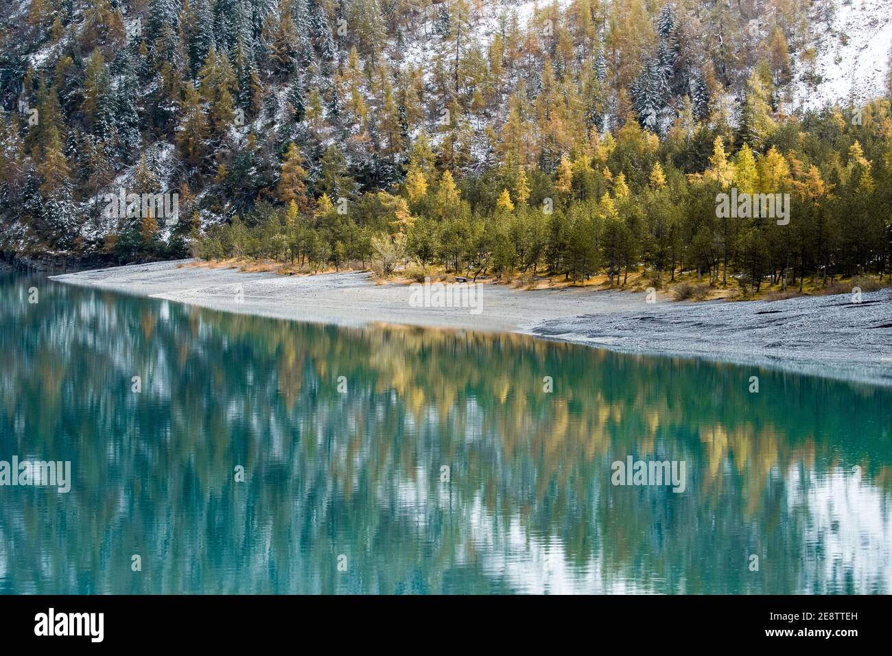 mountain lake Oeschinensee in autumn in the Bernese Alps Stock Photo ...