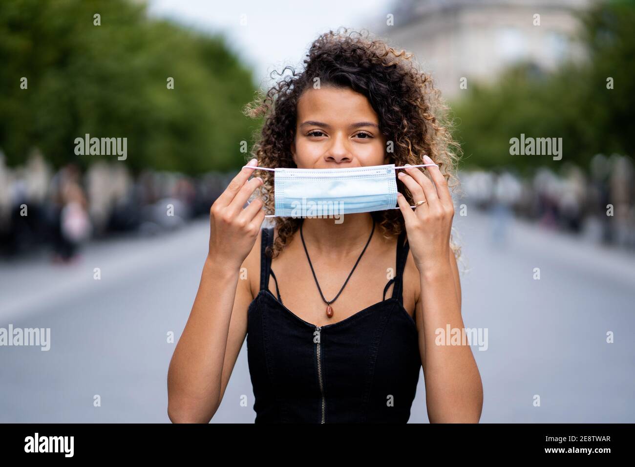 young female showing the proper way to wear a mask Stock Photo - Alamy