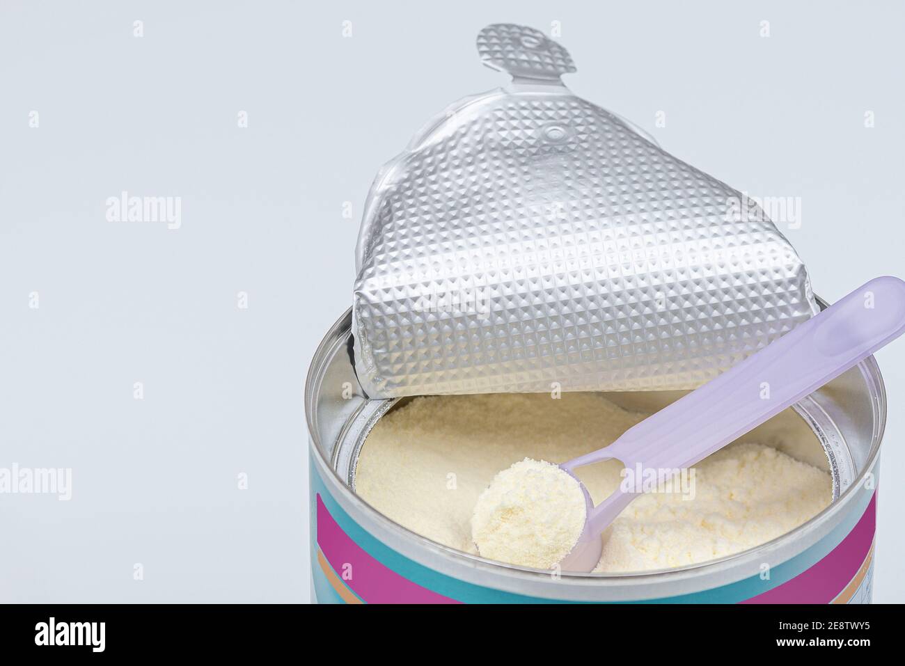 Infant formula in spoon. High angle view of baby formula and spoon in ...
