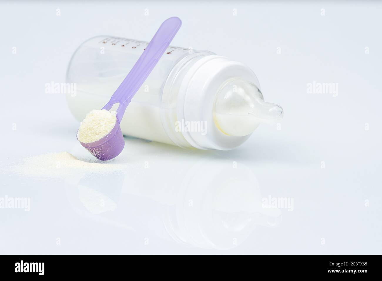 Baby milk bottle, Baby food. Powder in spoon and baby bottle. White ...