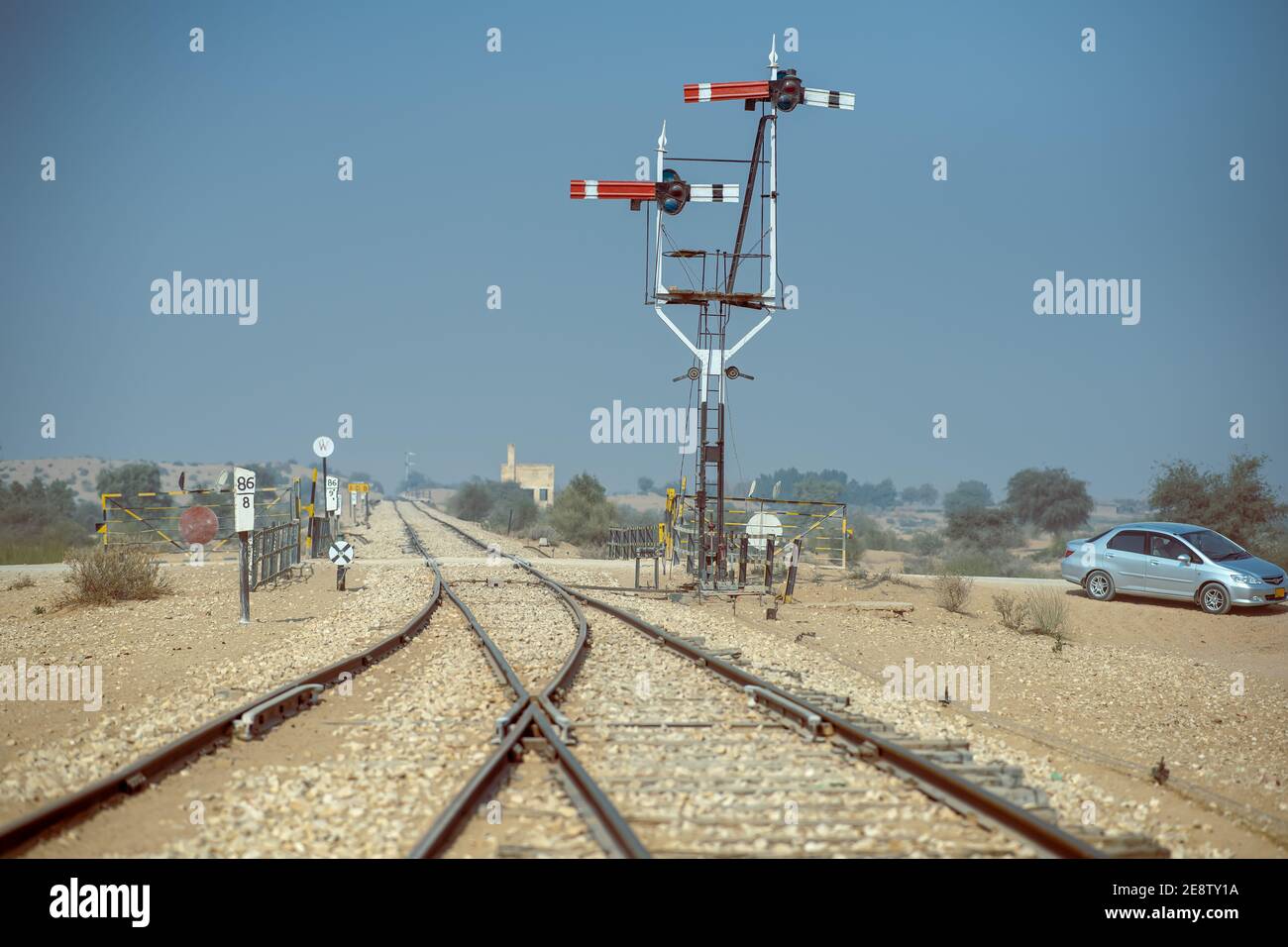 Railway tracks crossing intersection where passing tractor trolley ...