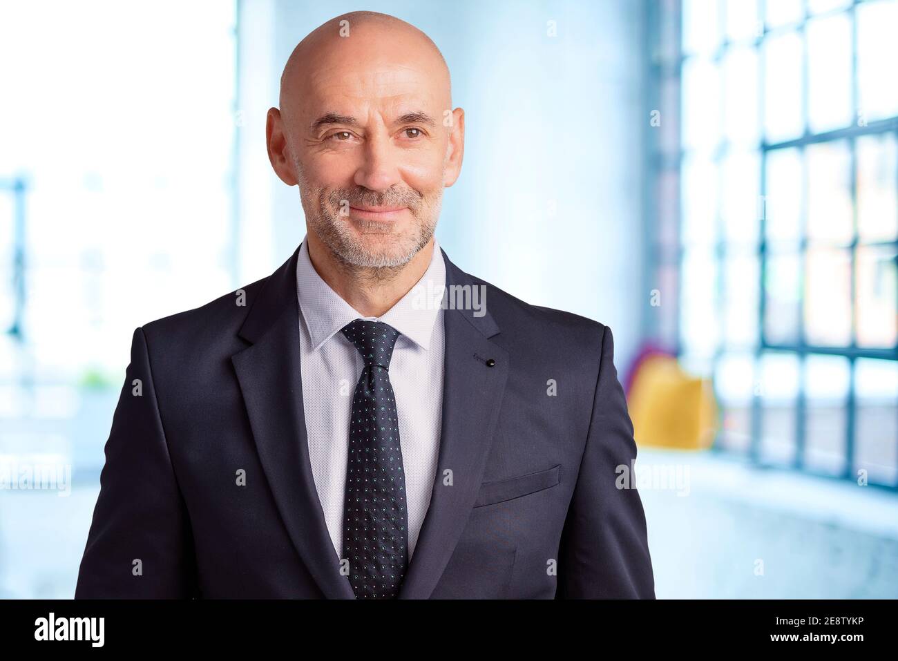 Portrait shot of executive businessman wearing suit and tie while ...