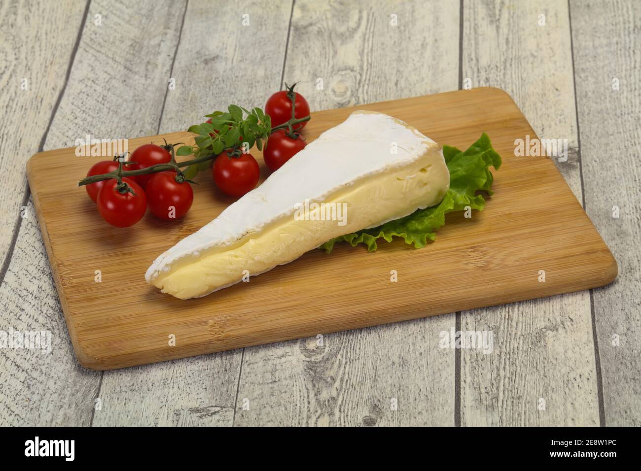 Brie cheese triangle served salad leaves Stock Photo - Alamy