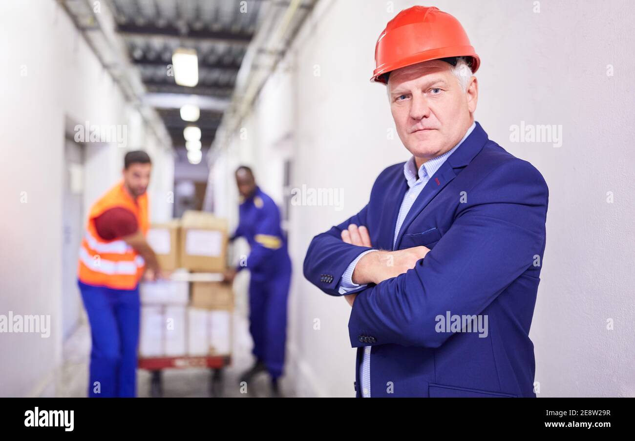 Entrepreneur as boss looks seriously in front of workers with push ...