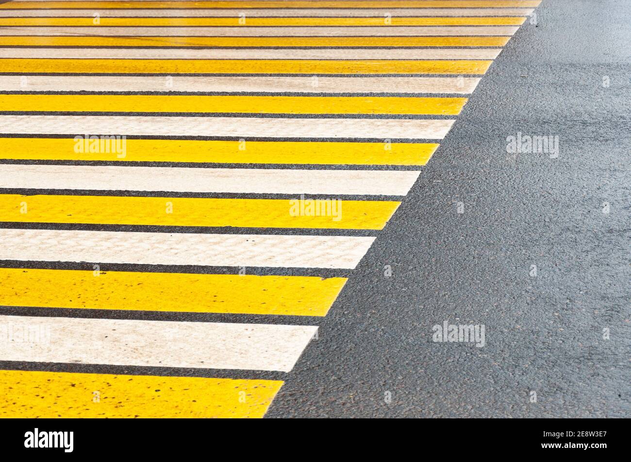 Crosswalk on the street for safety, white and yellow stripes Stock ...