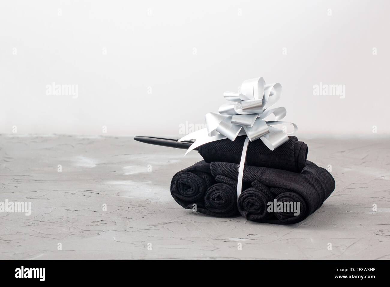 Handmade tanks of socks as gift to men on February 23 on grey ...