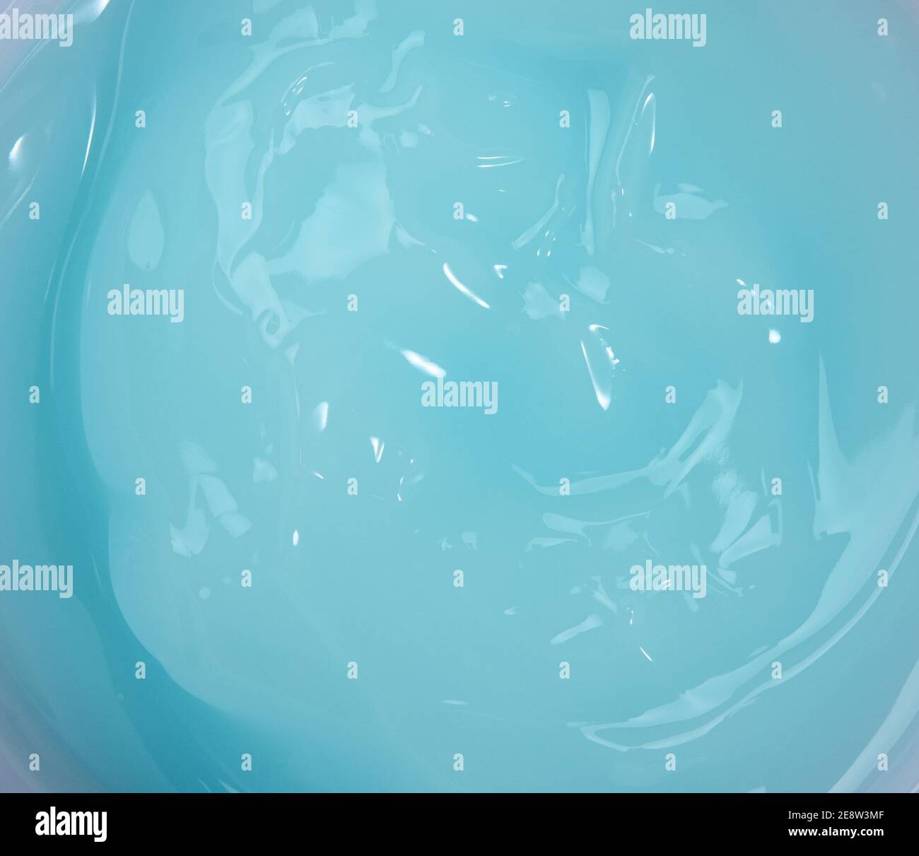 texture of blue moisturizing translucent cream in a plastic jar, top ...