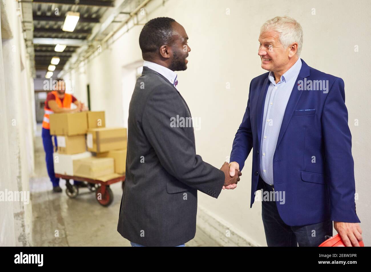 Two business people as successful entrepreneurs during handshake in the ...