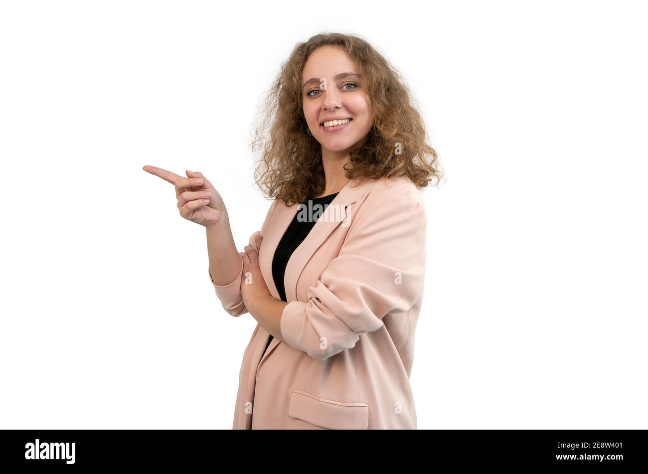 Beautiful woman in suit pointing to the side with her two hands ...