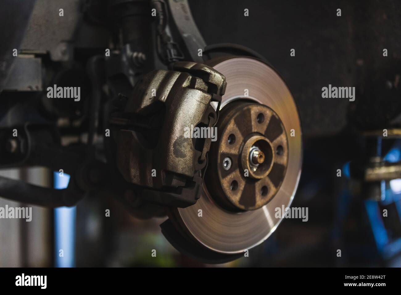 Caliper and brake disc of the front wheel of the car Stock Photo - Alamy