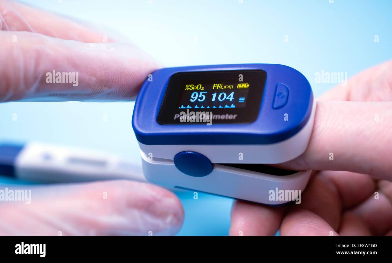pulse oximeter on patient finger Stock Photo - Alamy