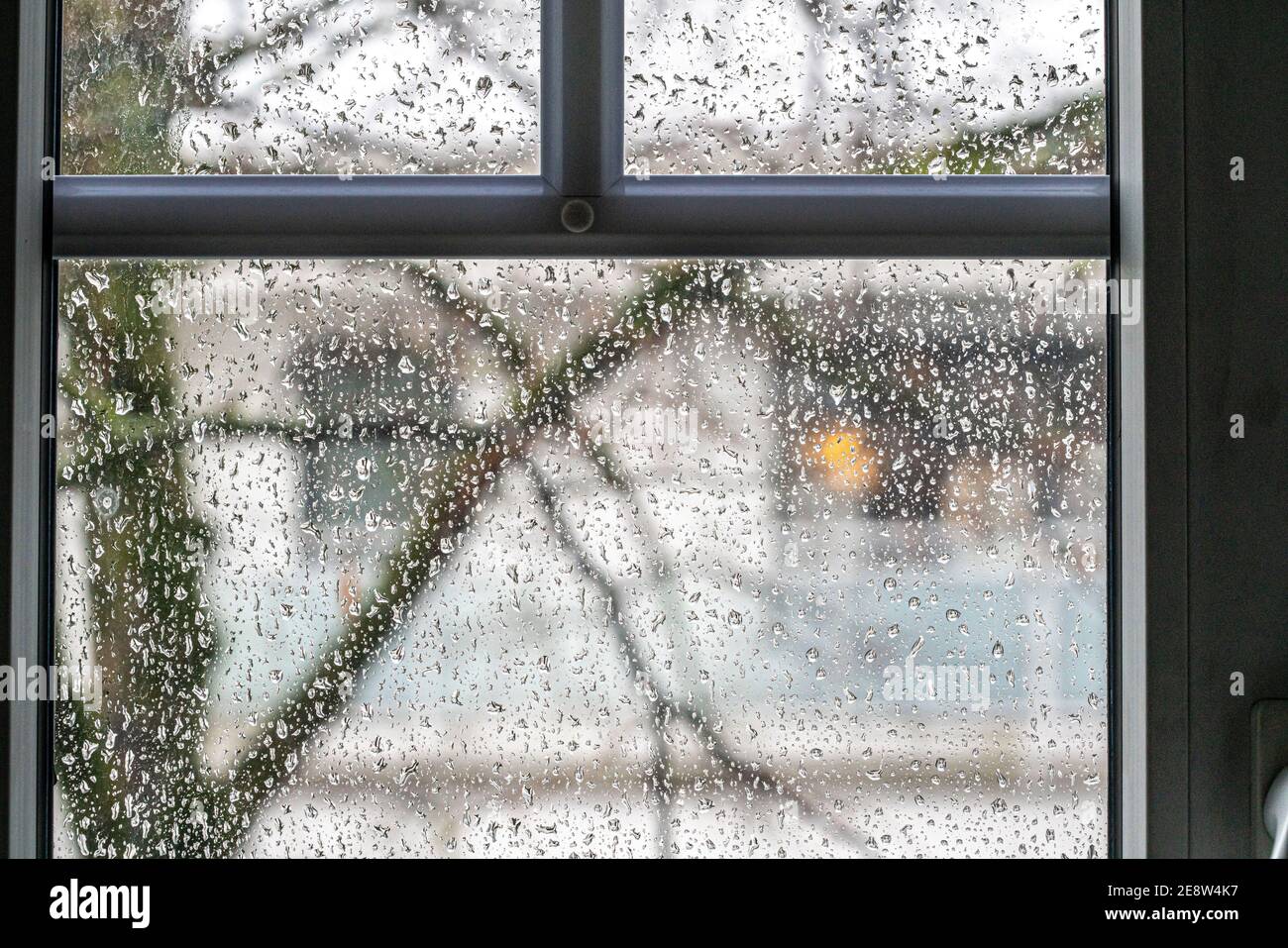 Rainy weather, raindrops on a window pane Stock Photo - Alamy