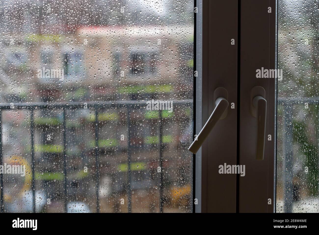 Rainy weather, raindrops on a window pane Stock Photo - Alamy