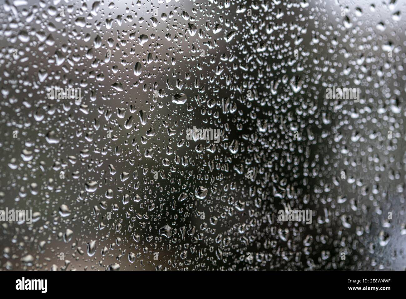 Raindrops trickle down glass hi-res stock photography and images - Alamy