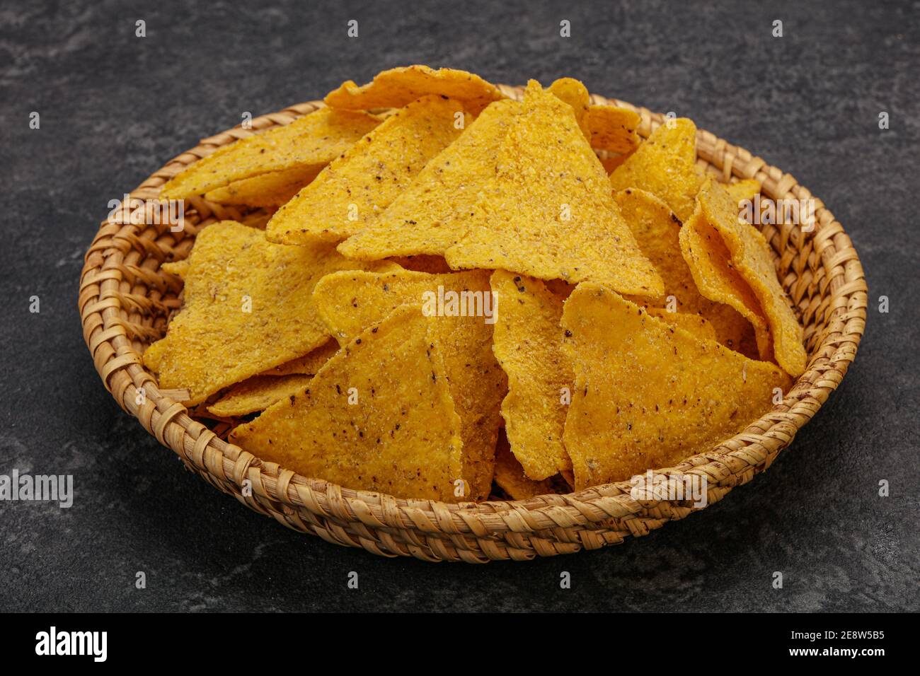 Mexican crunchy corn nachos triangle heap Stock Photo - Alamy