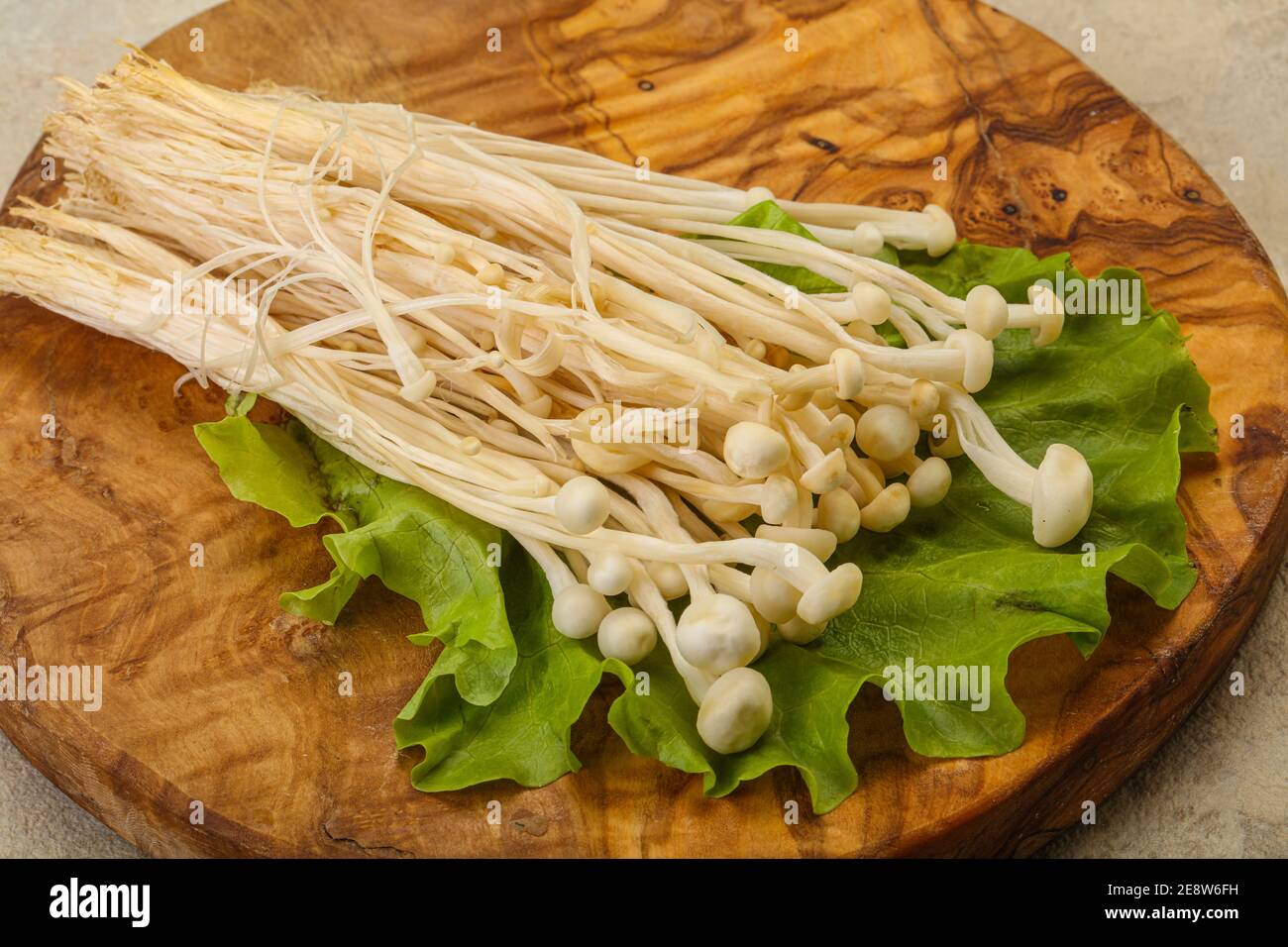 Raw Japanese Enoki mushrooms for cooking Stock Photo - Alamy