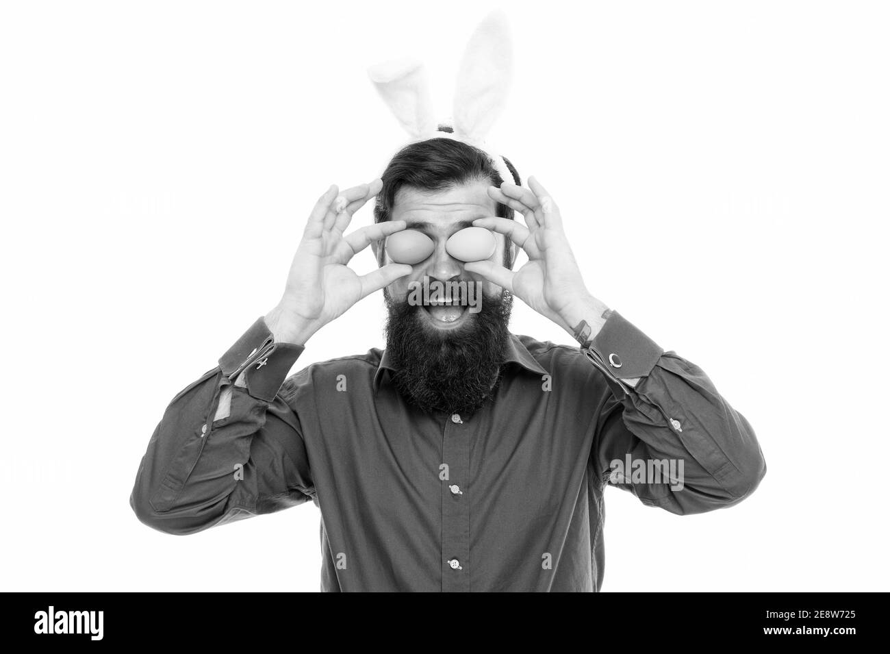 Look here. Easter man hold eggs as glasses. Happy man celebrate Easter ...