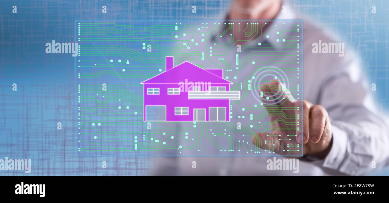 Man touching a digital smart home automation concept on a touch screen ...