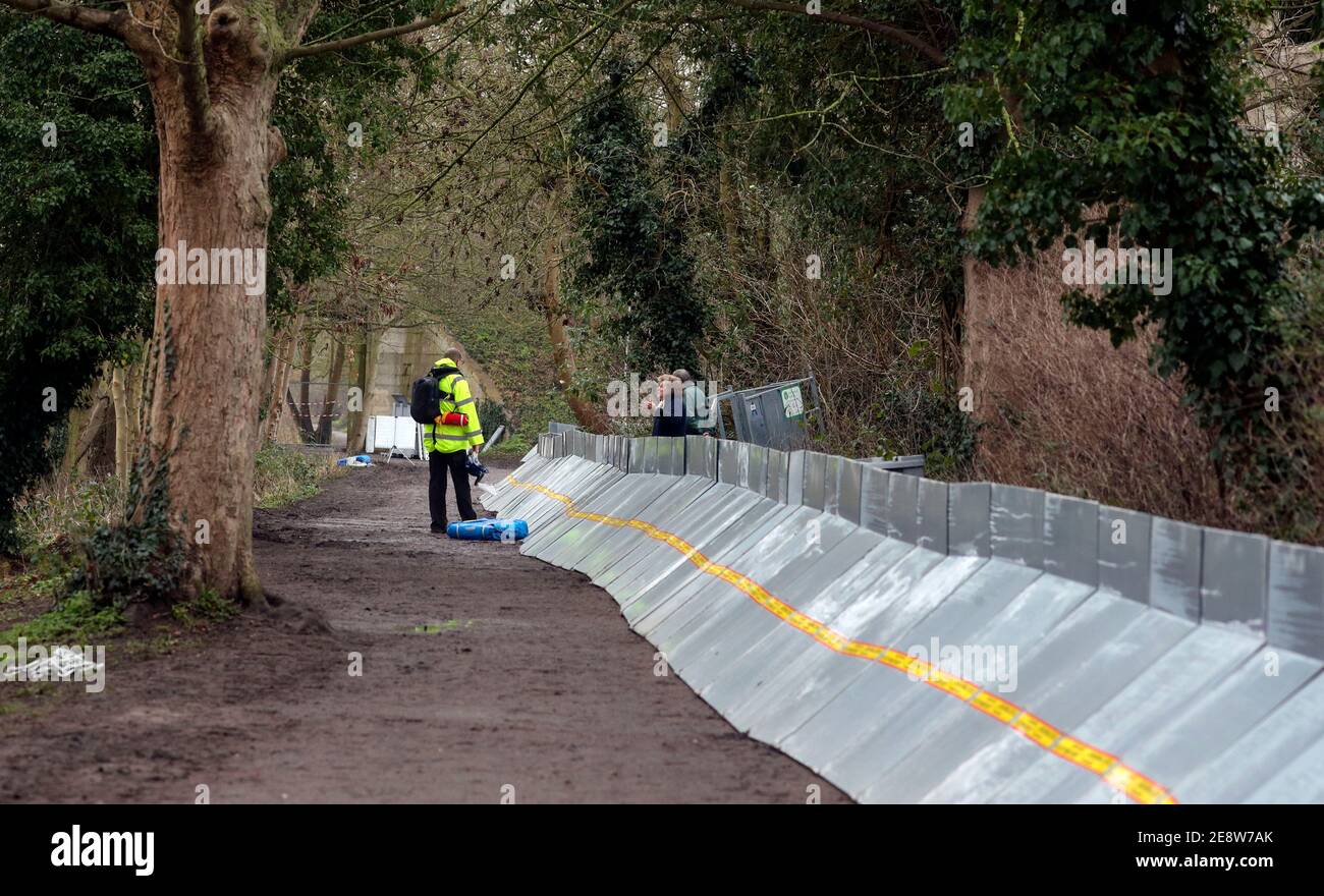 Workers at the temporary barrier in Weybridge, Surrey, after Storm ...