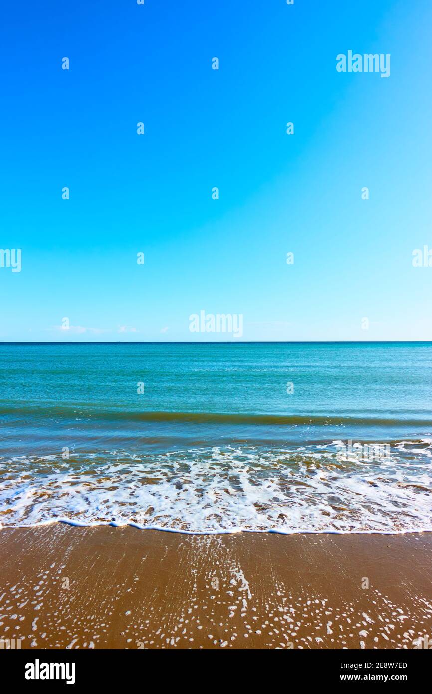 Sea and sandy beach -- Vertical seascape with space for your own text ...