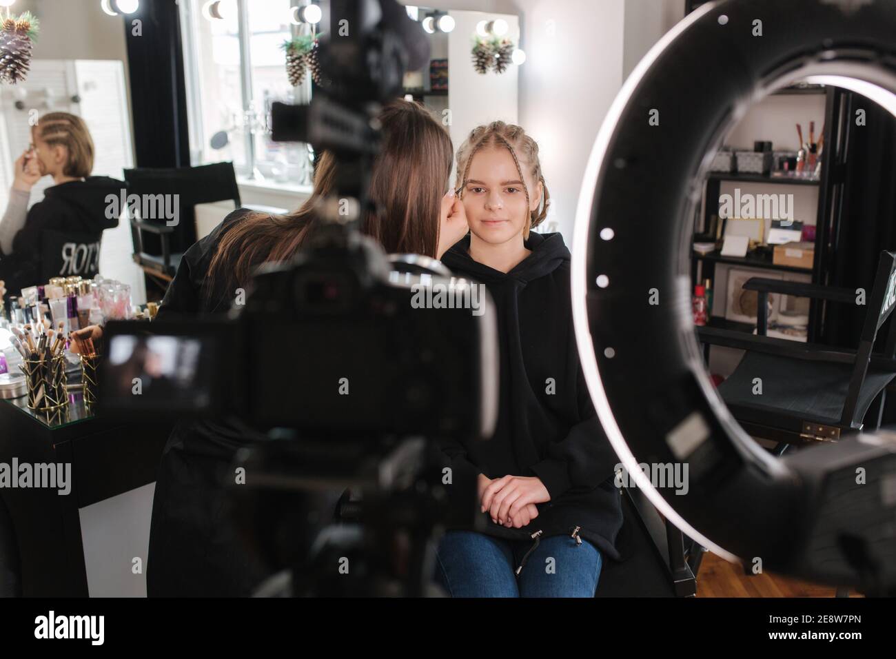 Woman make makeup for attractive blond hair woman in studio. Video of ...