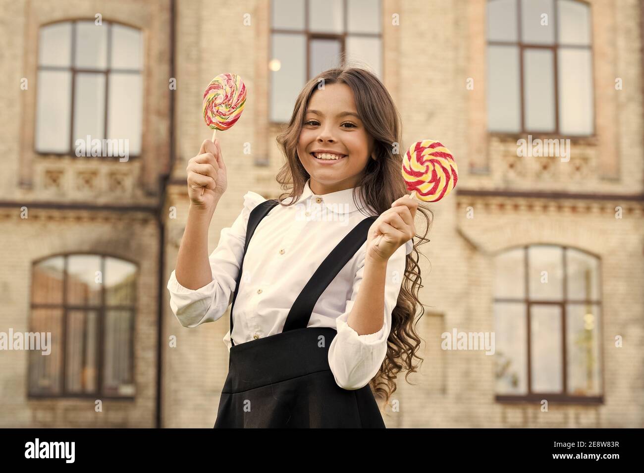 Picking flavour is hardest part. Schoolgirl choosing sweets. Happy kid ...