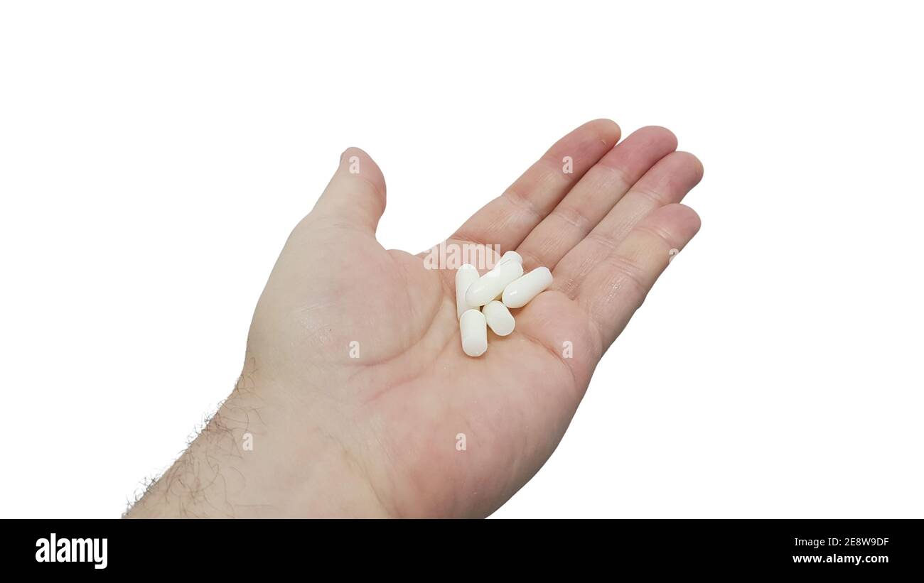 Hand holding rectal suppositories on white background Stock Photo - Alamy