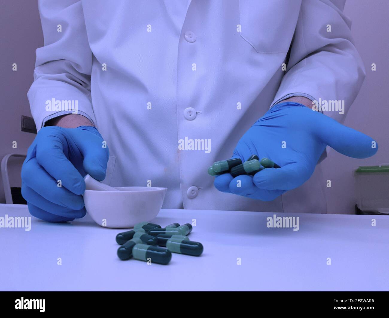 Pharmacist preparing capsules in a laboratory Stock Photo - Alamy