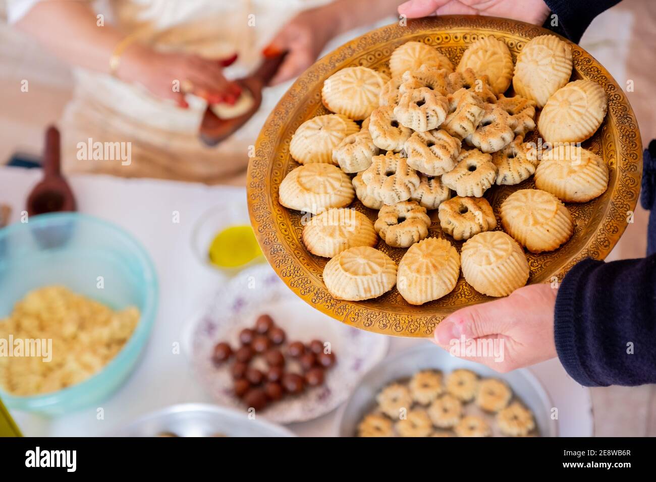 Arabic woman hands making eid sweets ,cookiesand mamoul Stock Photo - Alamy
