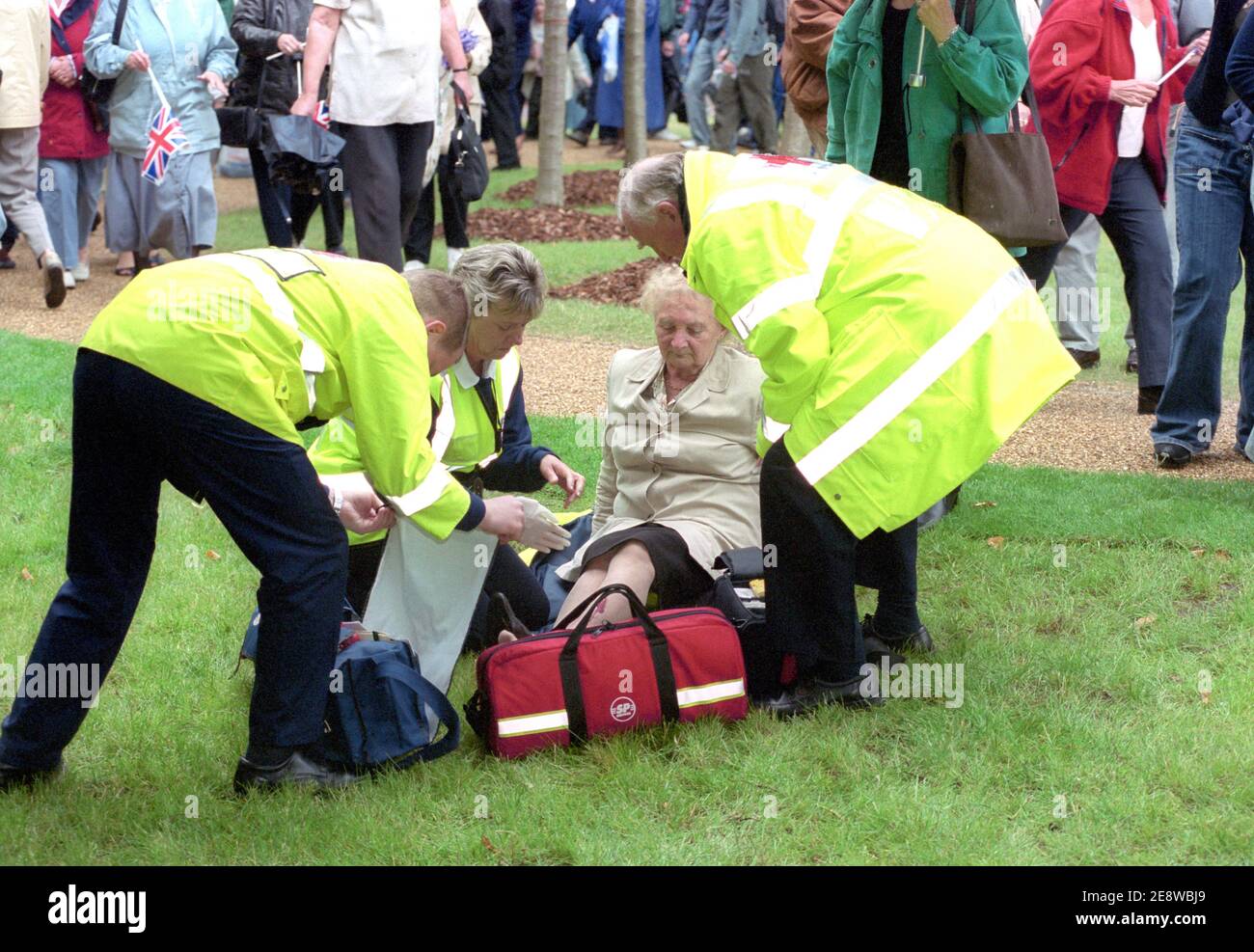An elderly woman is given First Aid to a left leg cut after she fell in ...