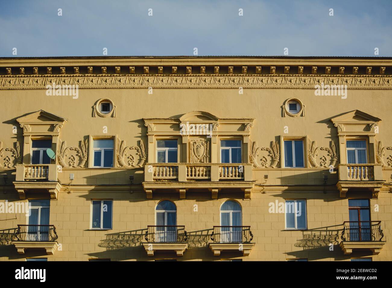 Facade of a soviet building at sunset. building with balconies. Soviet ...