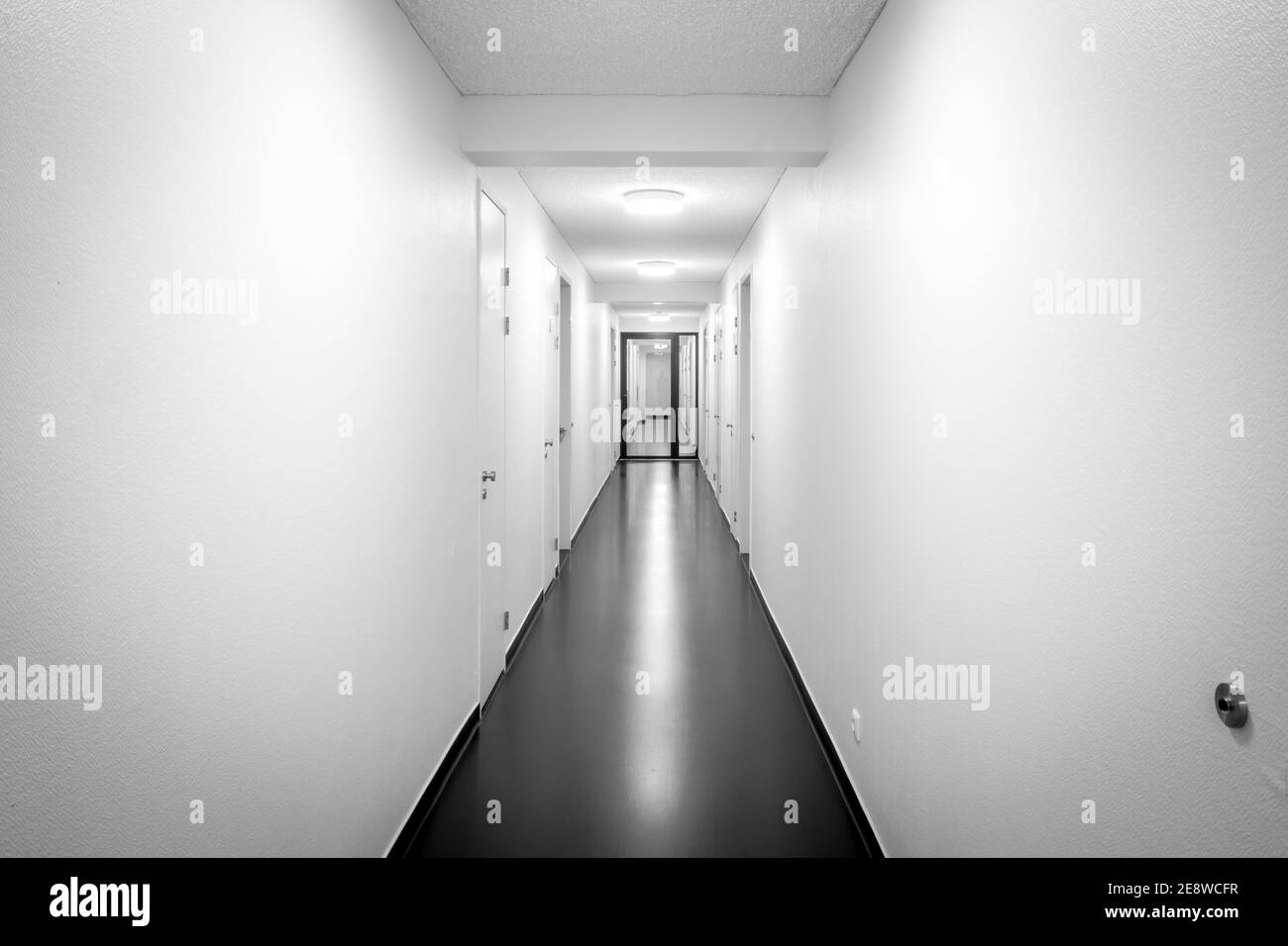 Empty white hallway in black and white Stock Photo - Alamy