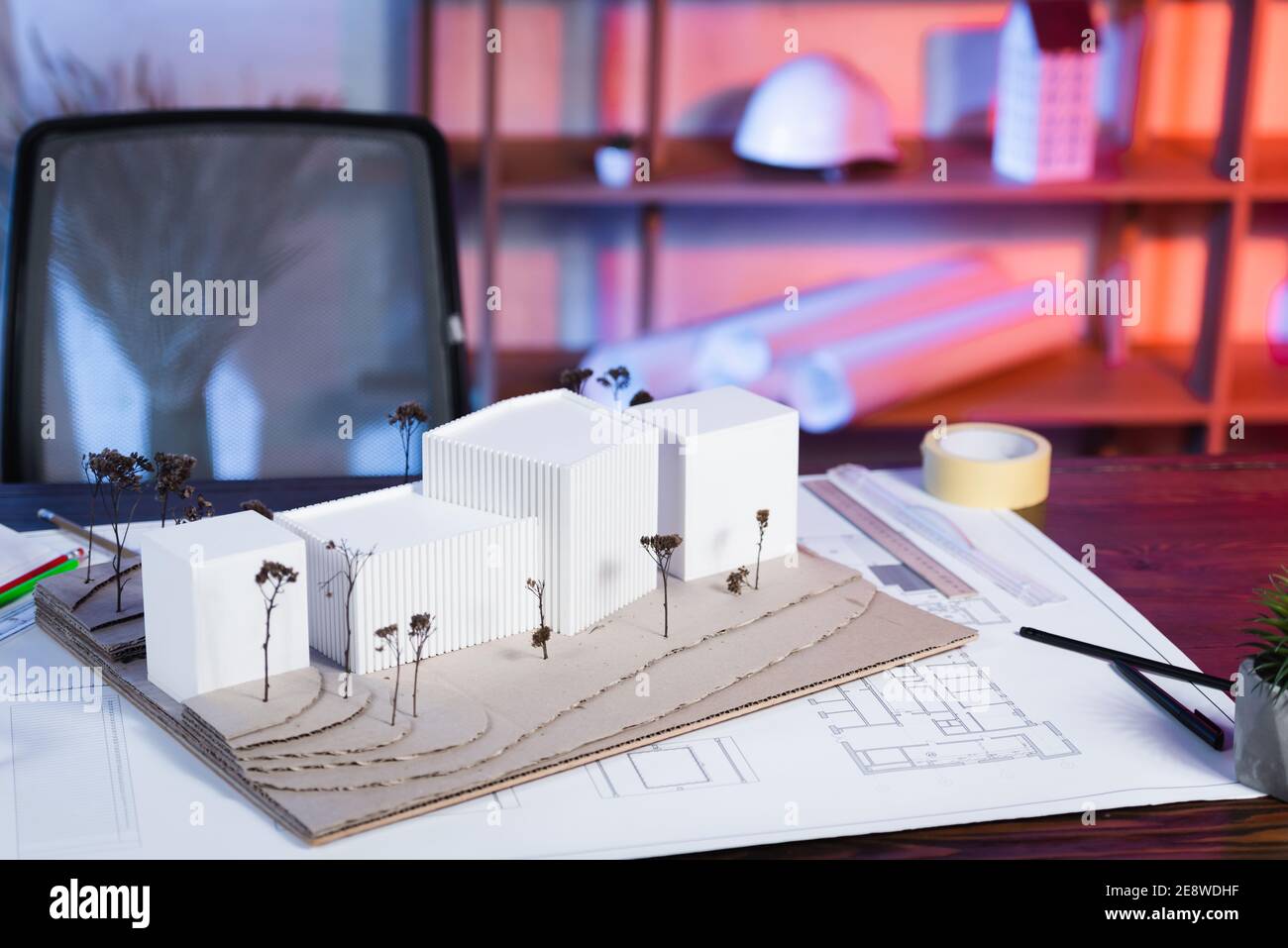 constructions models near blueprint on desk in architectural bureau ...