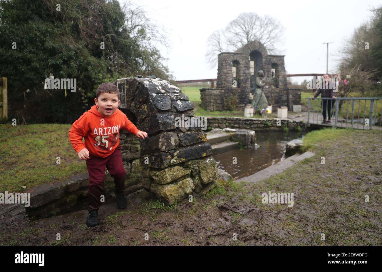 Christine Barry watches her son Sean, four, emerge from the waters as ...