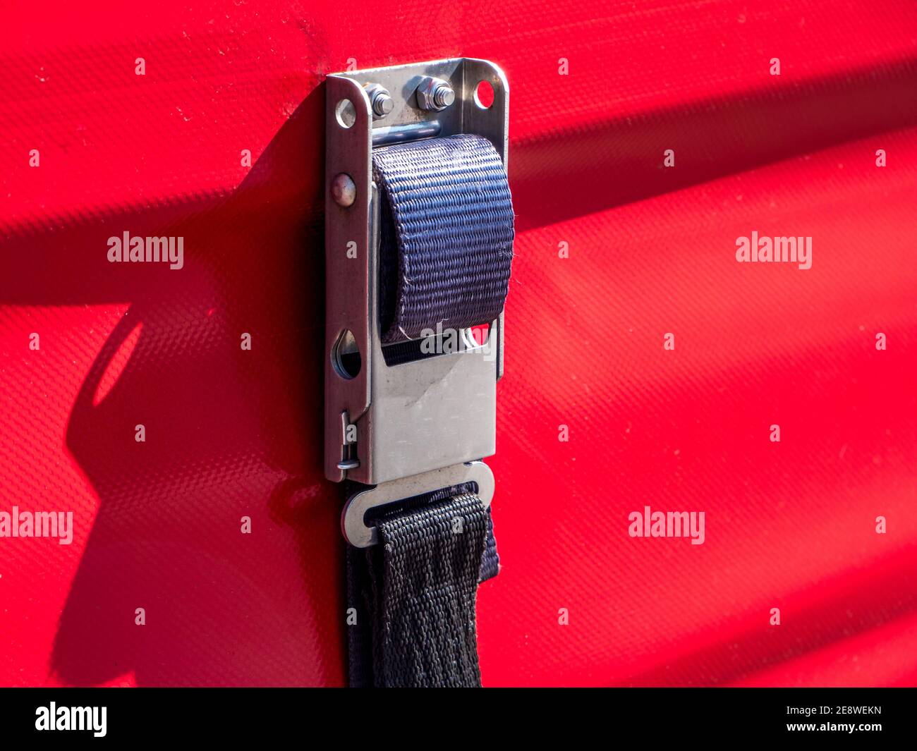 Load securing with lashing strap Stock Photo - Alamy