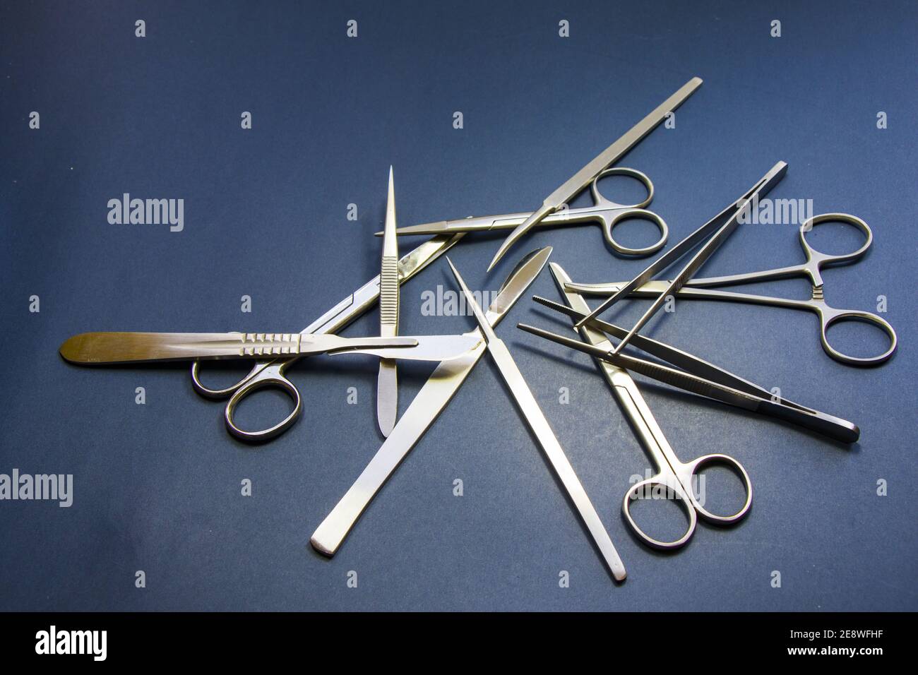 Top view of a medical dissection kit on a blue surface Stock Photo - Alamy