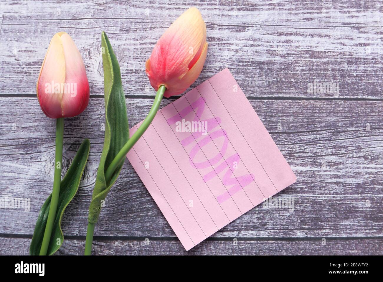 mother day concept with tulip flower and mom text on sticky note Stock ...