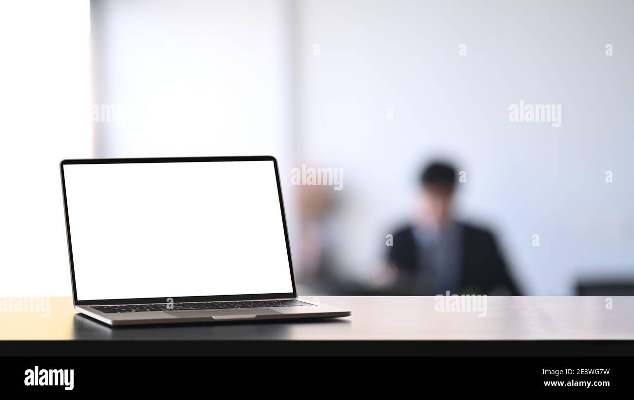 Laptop computer empty screen on black tablet in conference room with ...