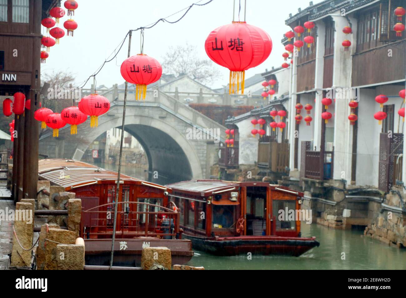 SUZHOU, CHINA - FEBRUARY 1, 2021 - Tourists see red lanterns hanging in ...