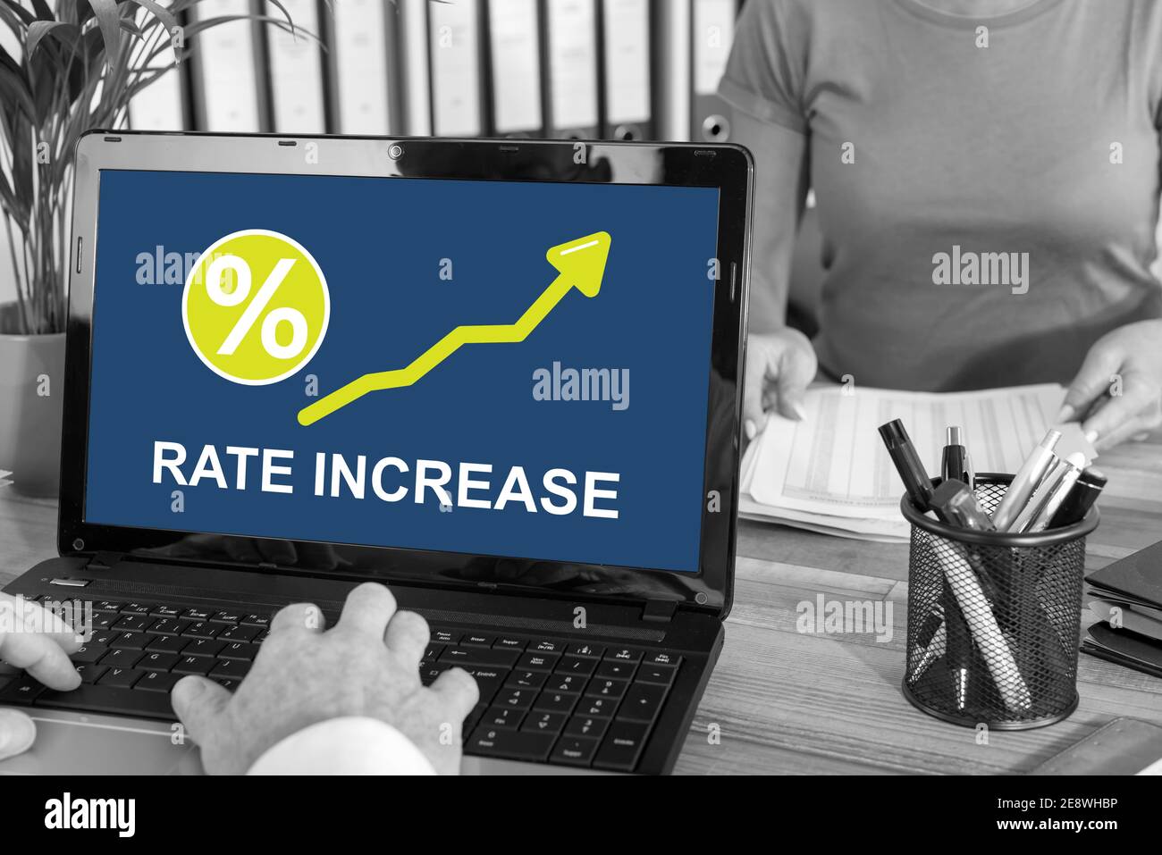 Laptop screen with rate increase concept Stock Photo - Alamy