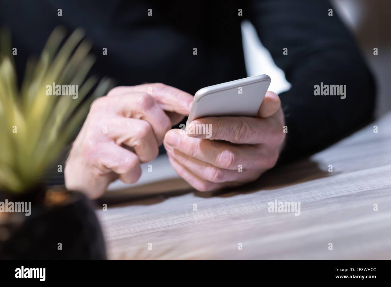 Male hand using mobile phone Stock Photo - Alamy