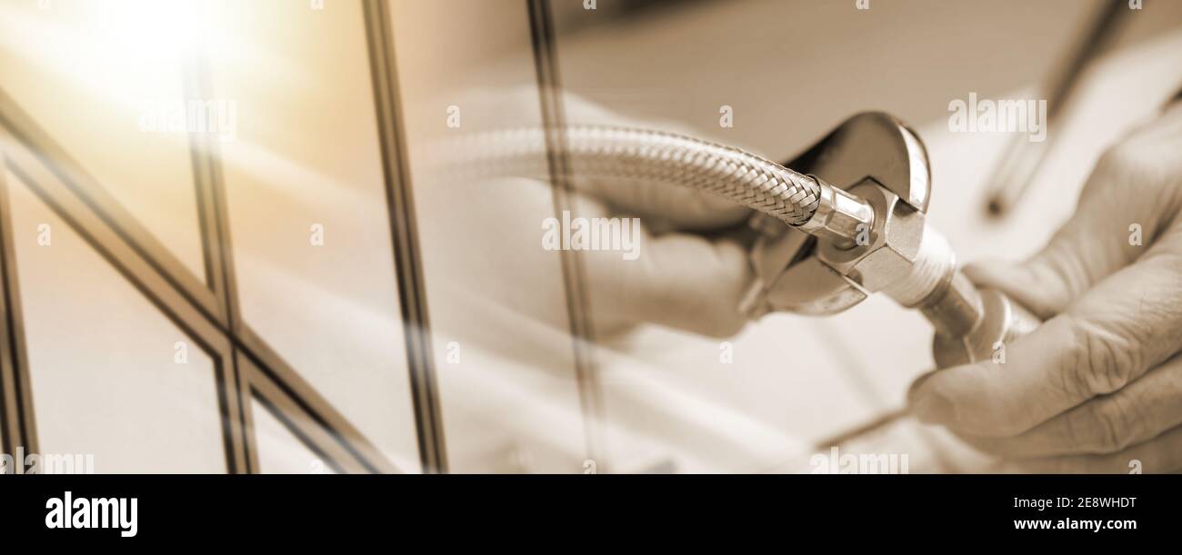 Plumber screwing a plumbing fitting on a pipe; multiple exposure Stock ...
