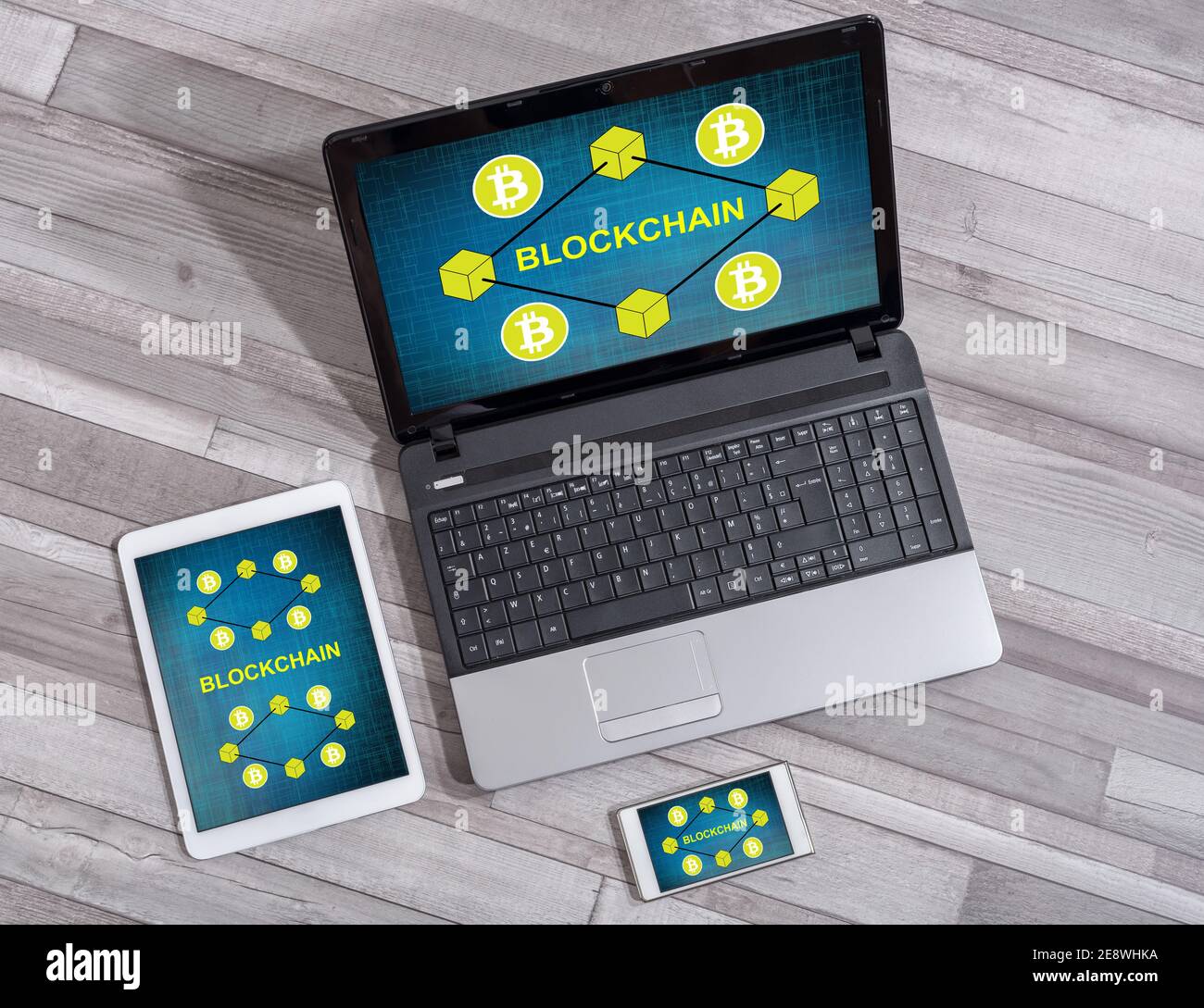 Blockchain concept shown on different information technology devices ...
