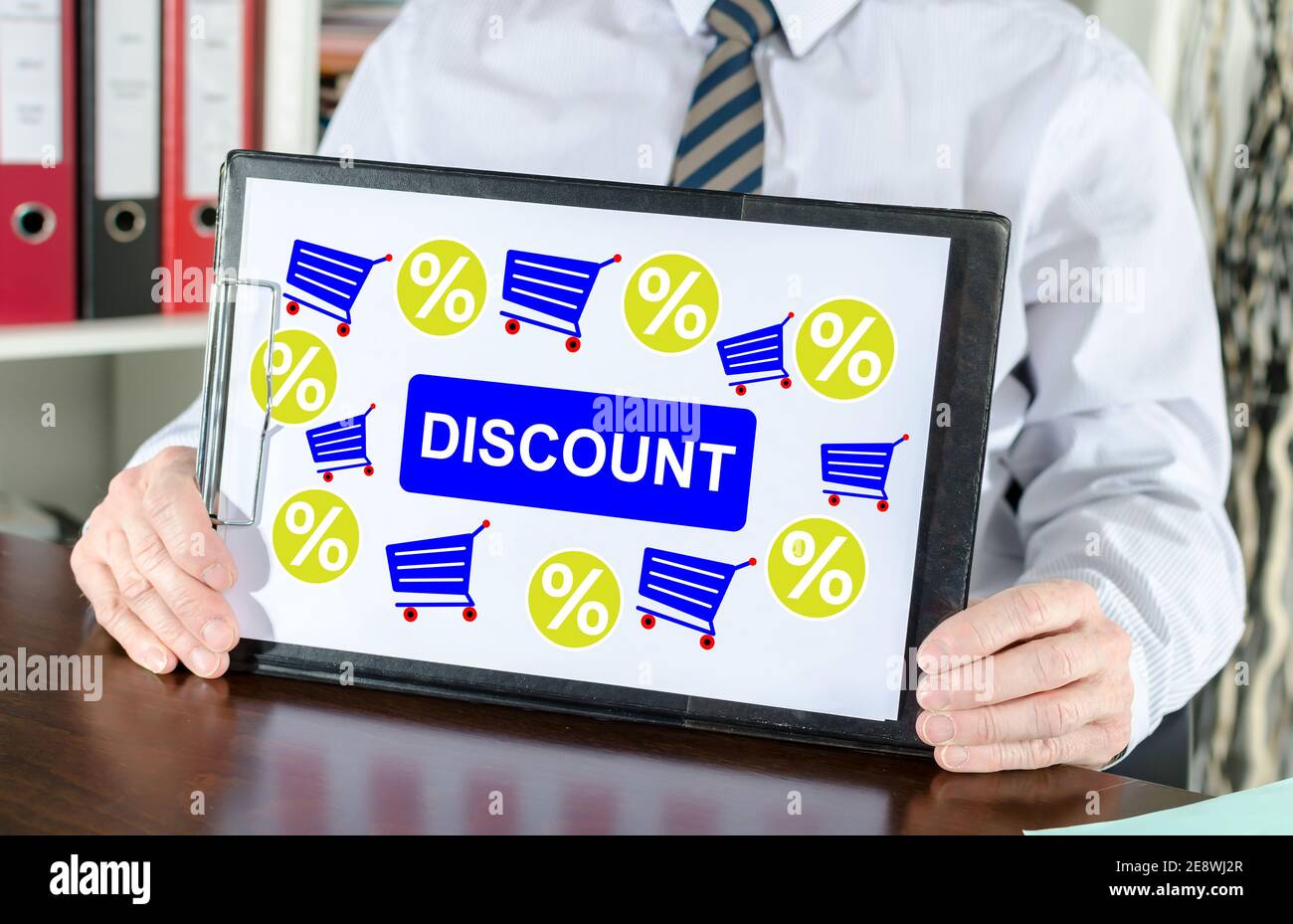Discount concept shown by a businessman Stock Photo - Alamy
