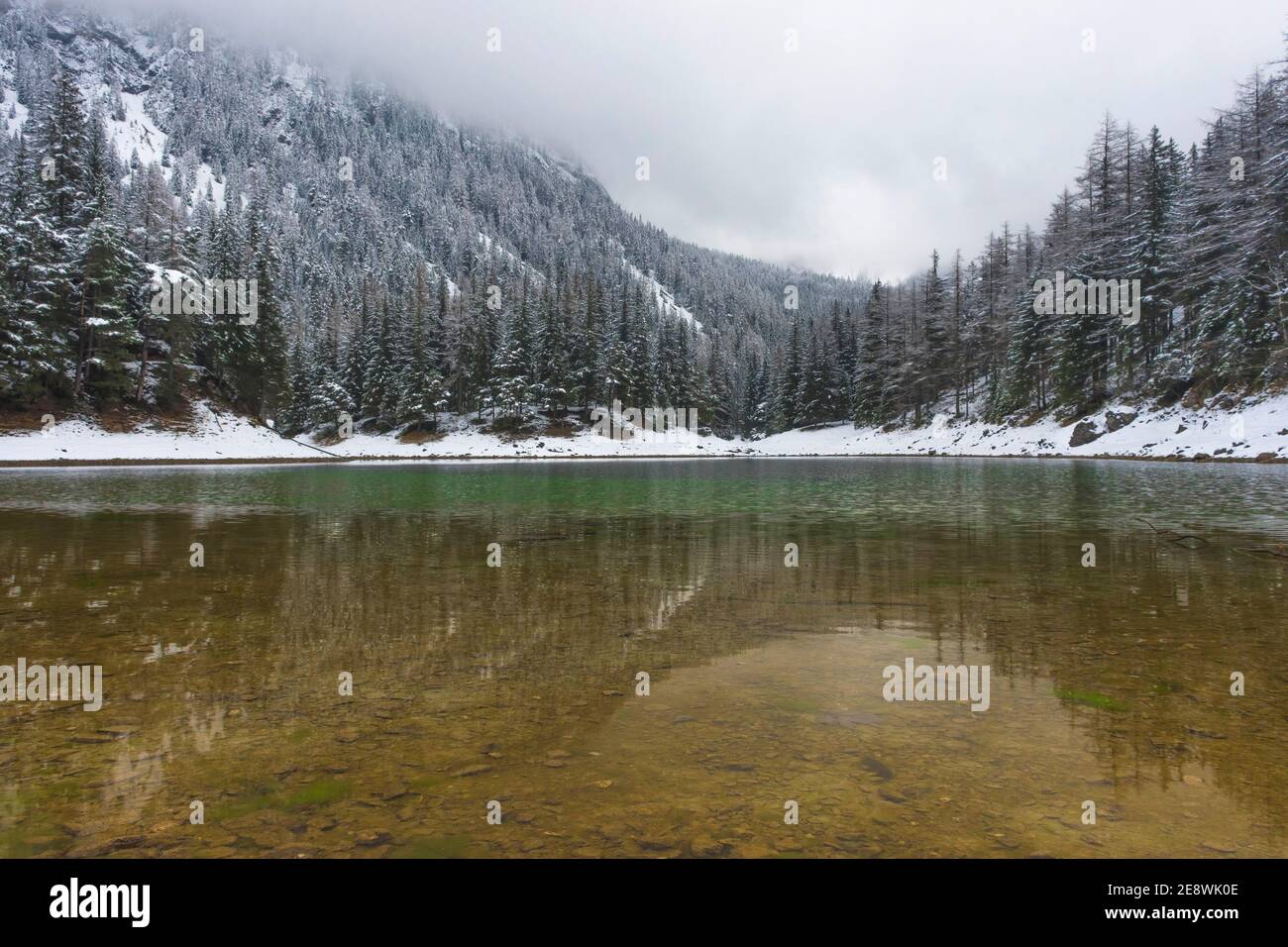 Amazing winter landscape with snowy mountains and clear waters of Green ...
