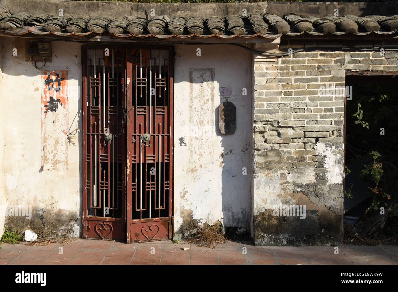 The entrance of an old abandoned house in Ping Yeung Old village in ...
