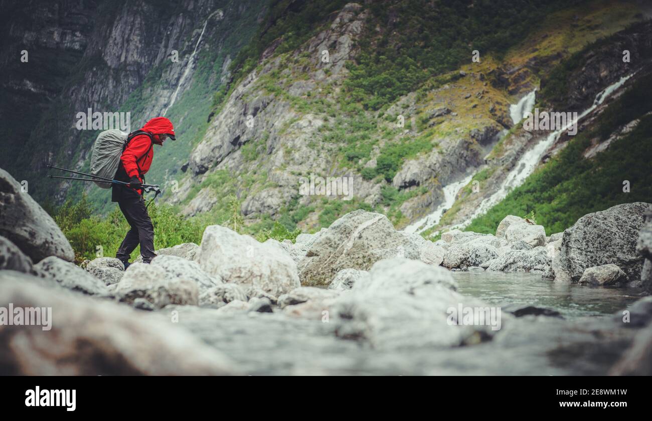 Caucasian Hiker Wearing Red Raincoat on the Scenic Alpine Trailhead ...