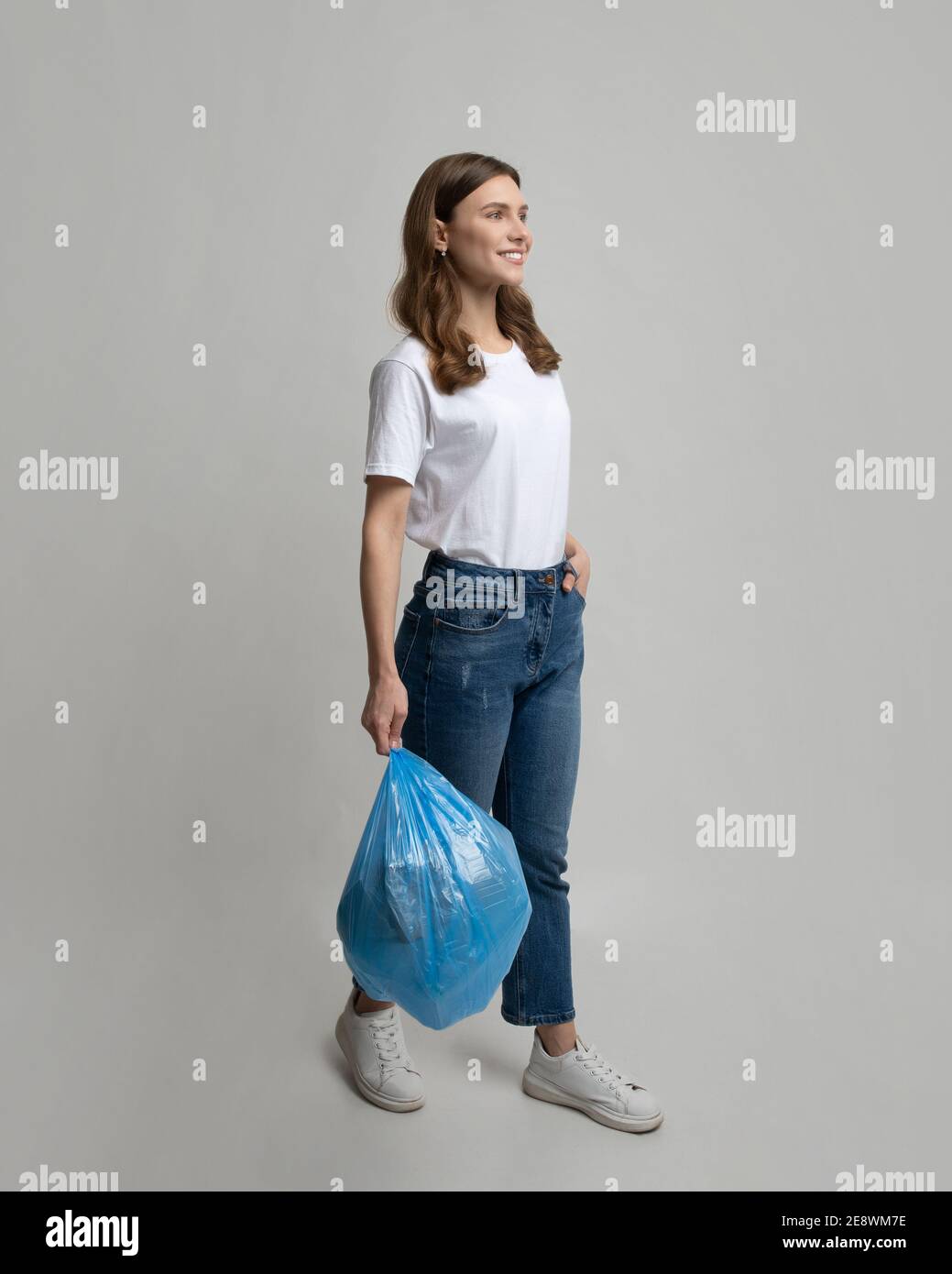 Holding garbage bag full plastic hi-res stock photography and images ...
