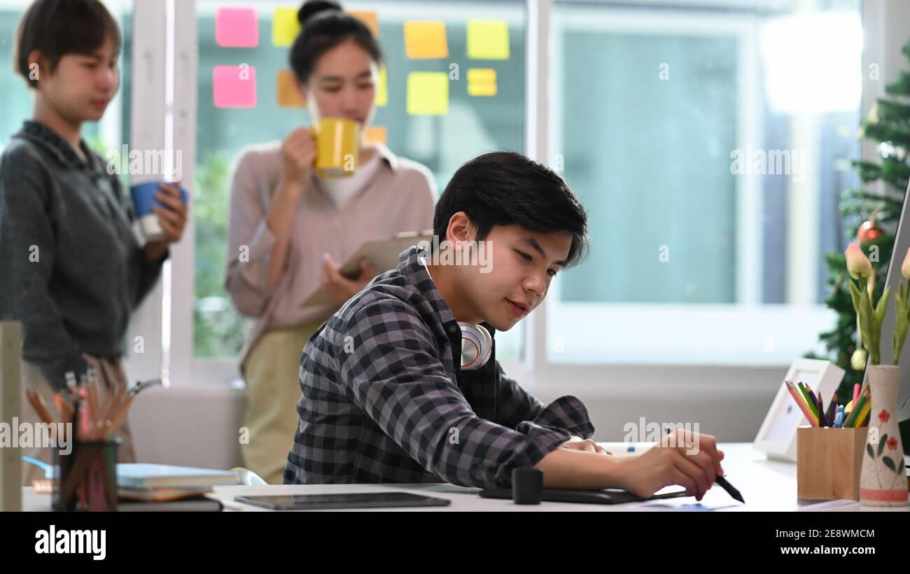Coworking space with creative people working together at modern office ...